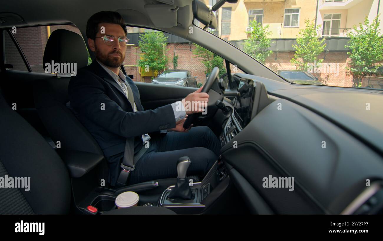 Caucasian man guy male driver auto owner businessman driving sit inside ...
