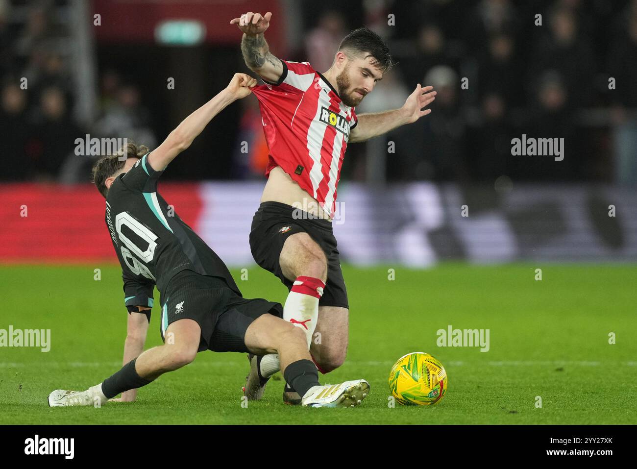 Liverpool's Tyler Morton pulls Southampton's Ryan Manning during the ...