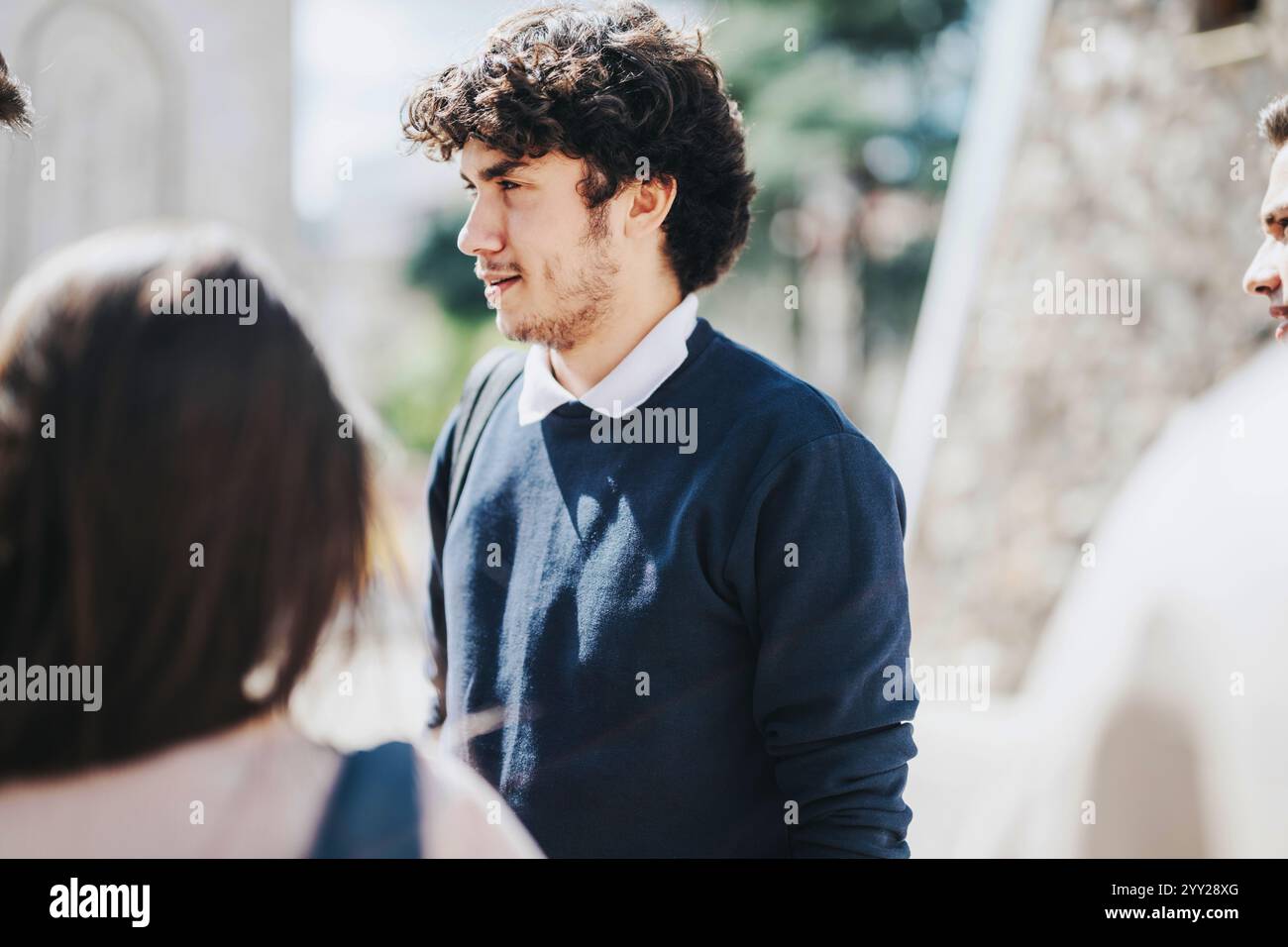 High school students engage in outdoor learning activity with professor ...