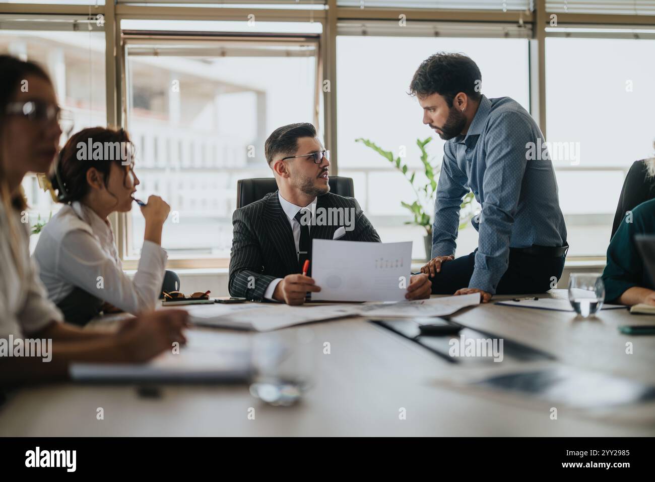 Dynamic team engaged in data hi-res stock photography and images - Alamy