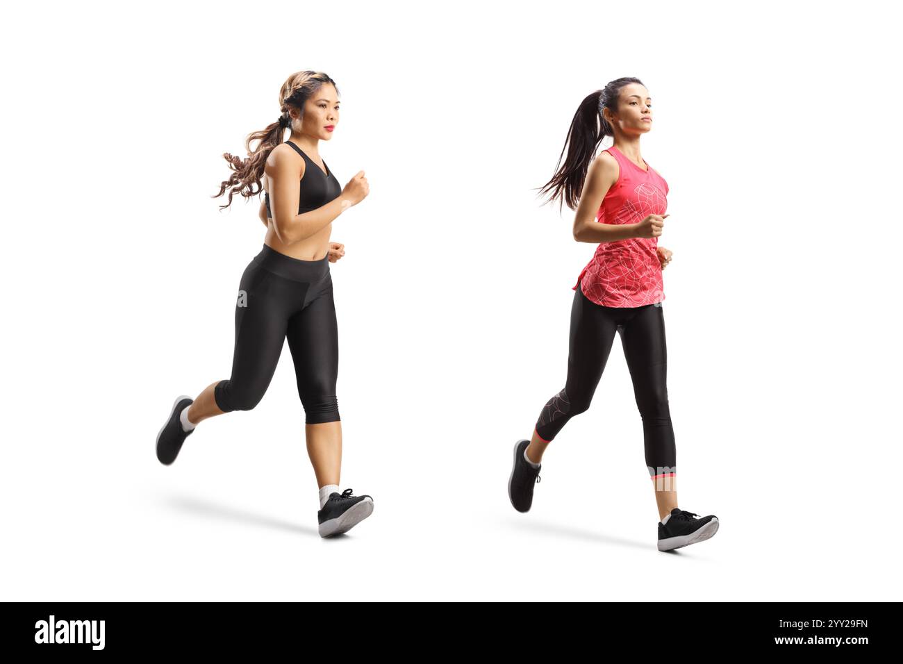 Two young women jogging isolated on white background Stock Photo - Alamy