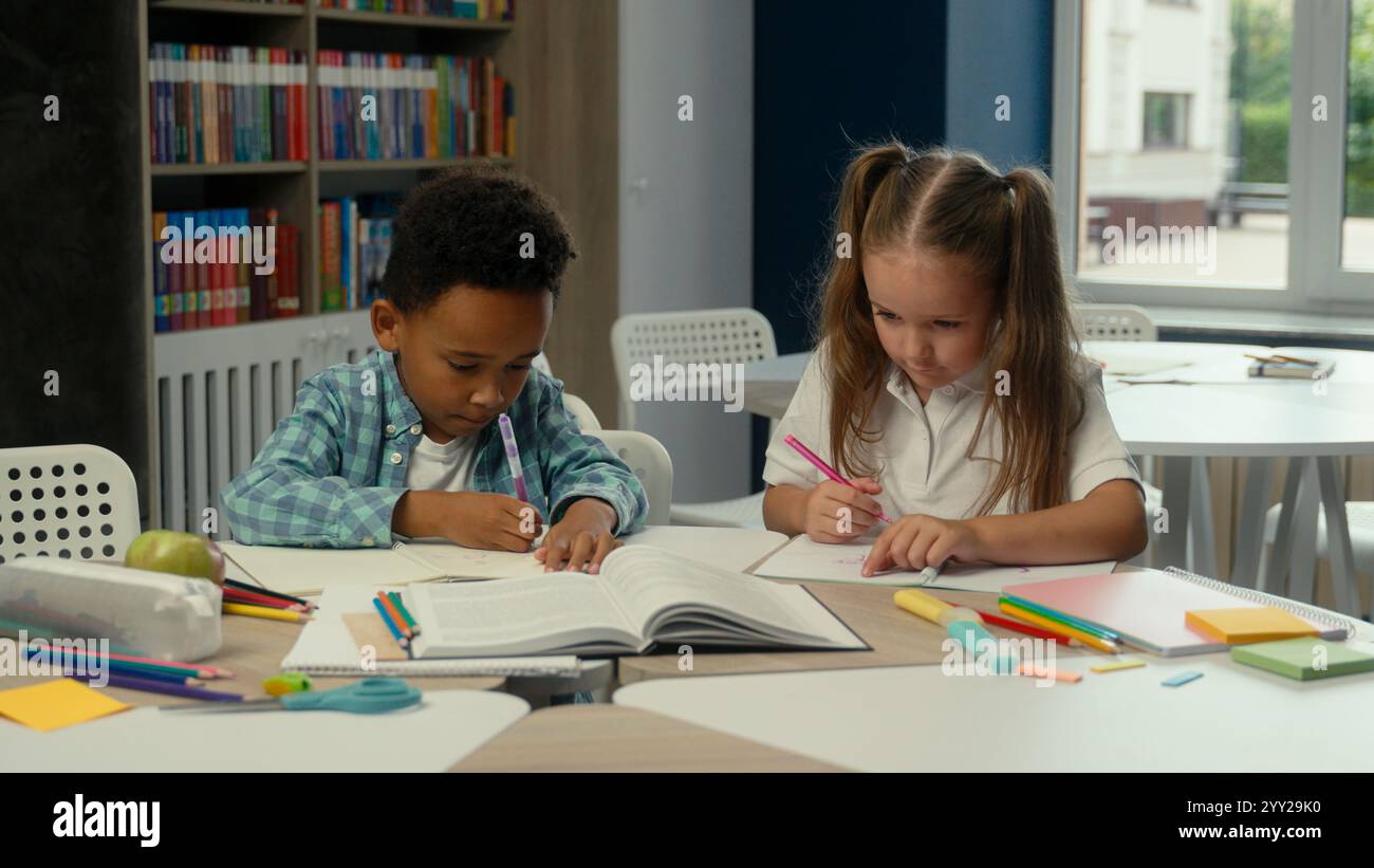 Multiethnic little kids classmates African boy Caucasian girl daughter ...