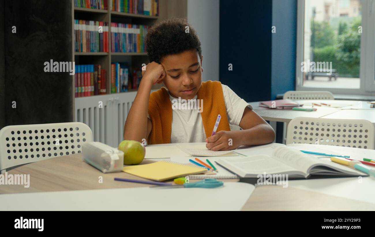 School classroom studying African American kid little boy son schoolboy ...