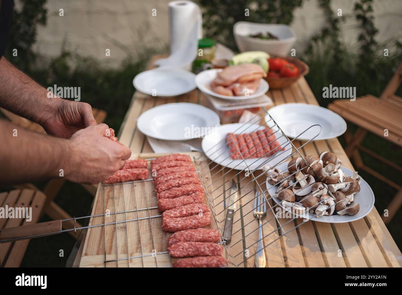 Preparing a flavorful barbecue feast in a vibrant backyard setting ...