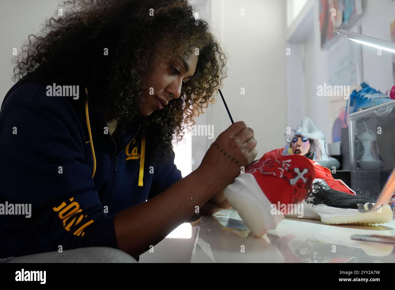 California basketball player Jayda Noble paints shoes in Berkeley ...
