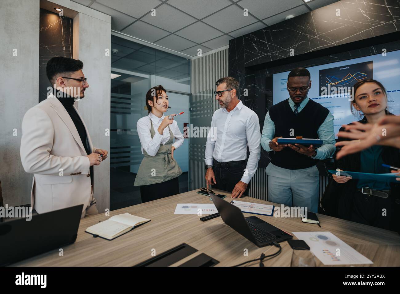 Multicultural team engaged in a corporate business meeting discussion ...