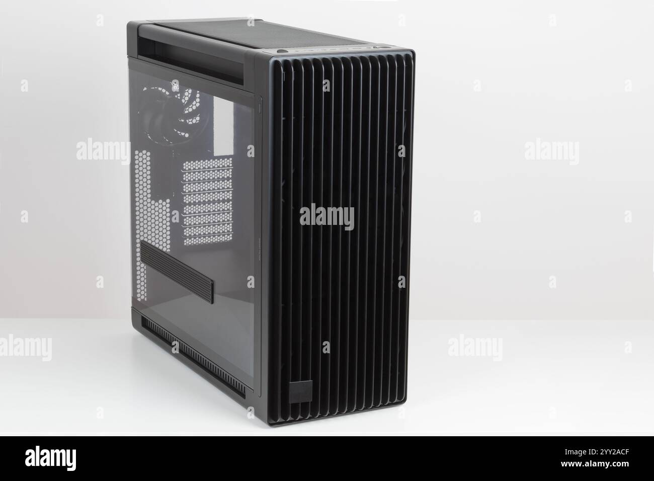 Side view of empty big tower, PC case, chassis, tempered-glass left ...