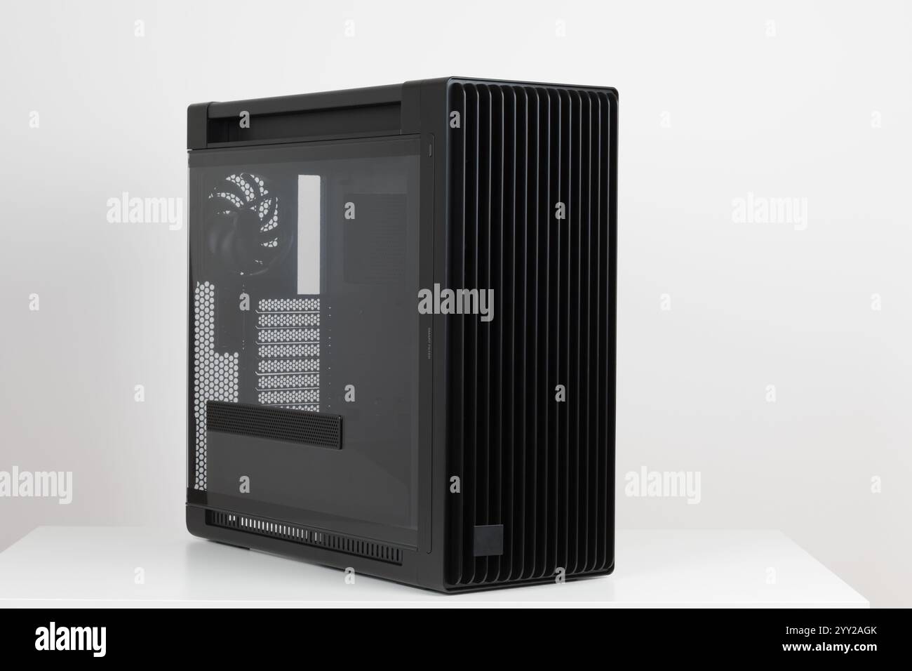 Side view of empty big tower, PC case, chassis, tempered-glass left ...