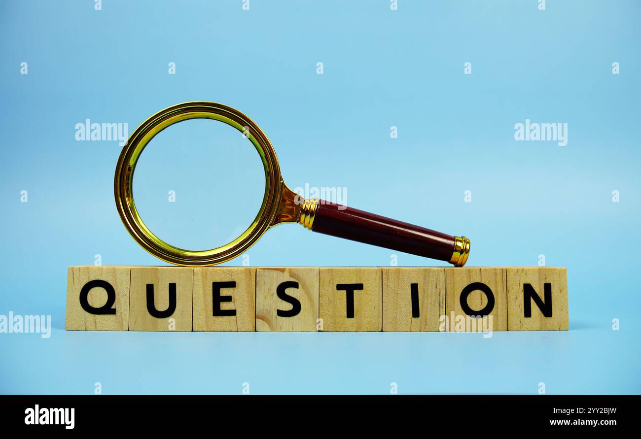 Question with wooden blocks alphabet letters and Magnifying glass on ...