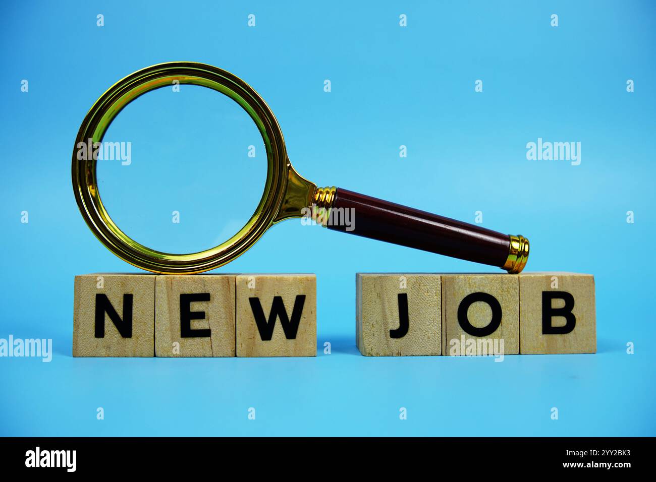 New Job with wooden blocks alphabet letters and Magnifying glass on ...