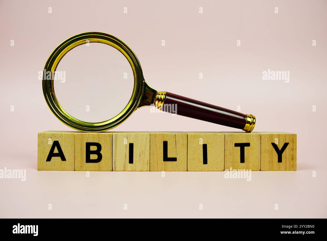 Ability with wooden blocks alphabet letters and Magnifying glass on ...