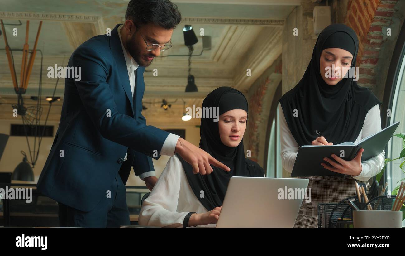 Three coworkers colleagues businessman businesswomen collaborate work ...