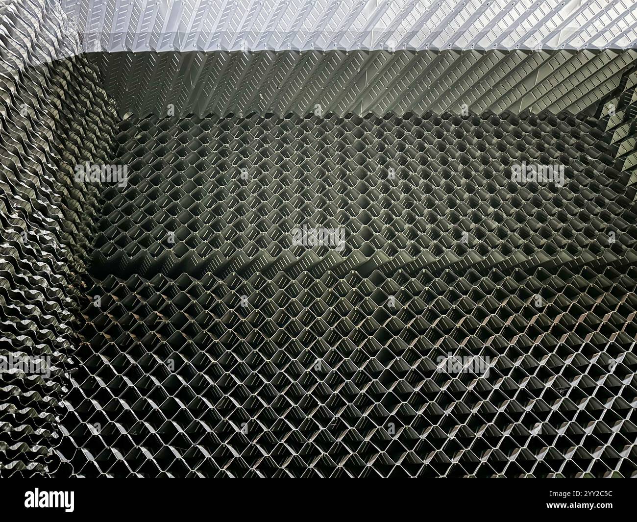 Close up of fabricated black plastic grid, mesh, material in a waste ...