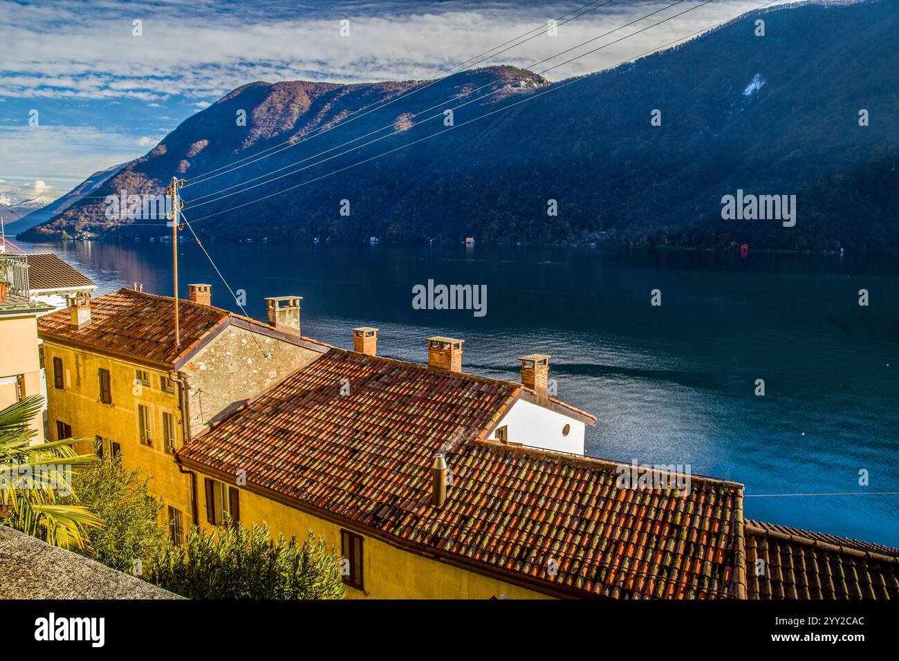 Amazing landscape with tile roofs of buildings, lake Como, other side ...