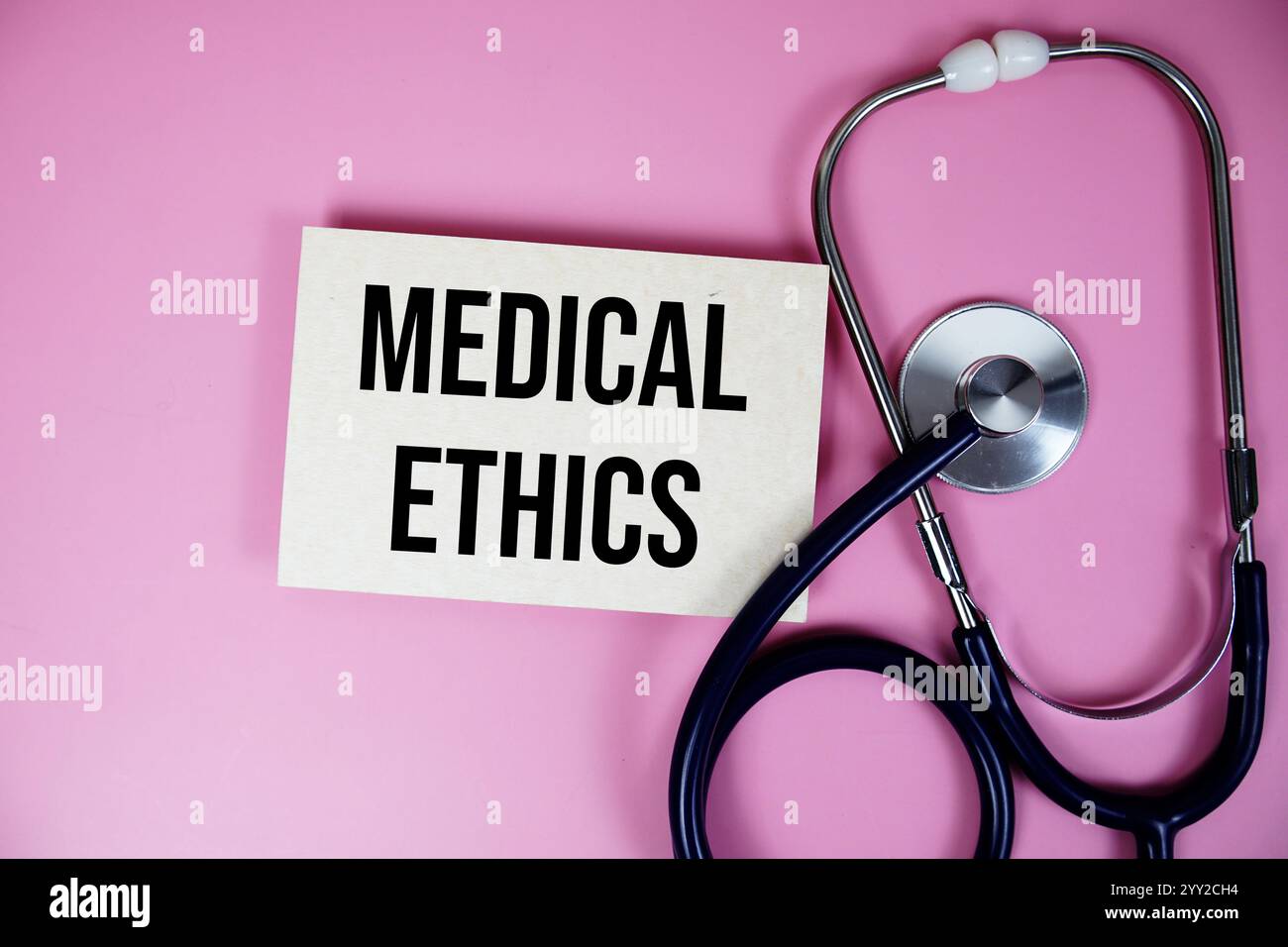 Medical Ethics text with Stethoscope on pink background, Healthy and ...