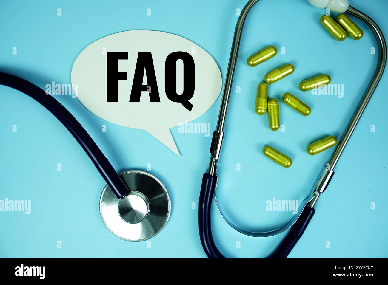 FAQ text with stethoscope and capsule medicine on blue background, Healthy and wellness concept ...
