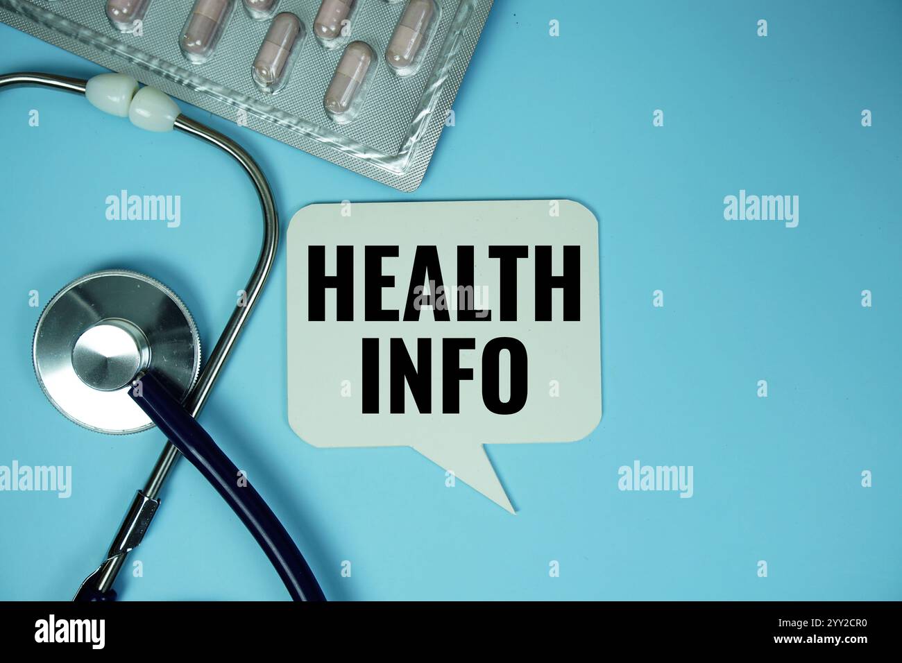 Health Info text on speech bubble with stethoscope top view on blue ...