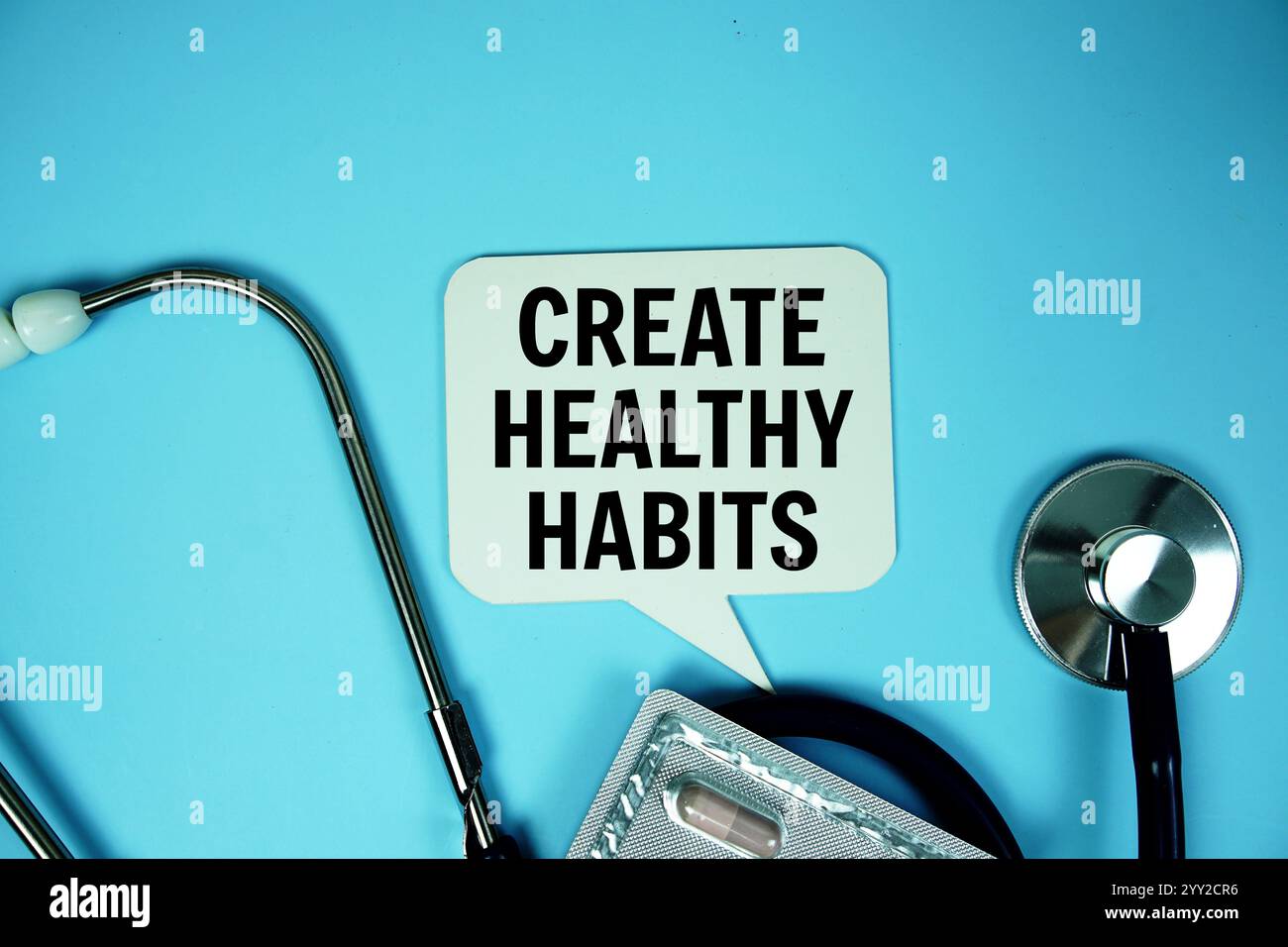 Create Healthy Habits text with stethoscope and capsule medicine on ...