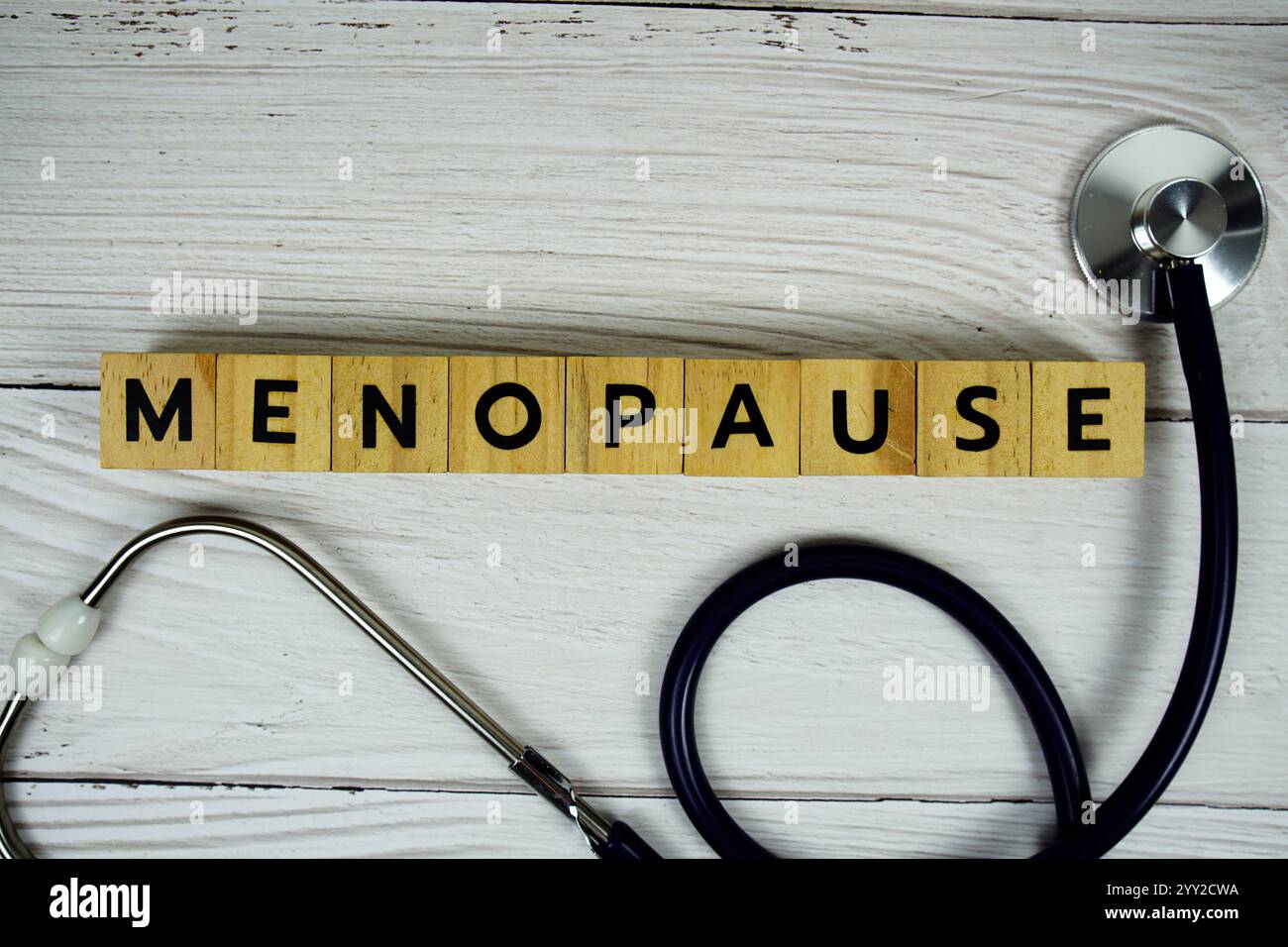 Menopause with wooden blocks alphabet letters and stethoscope on wooden ...