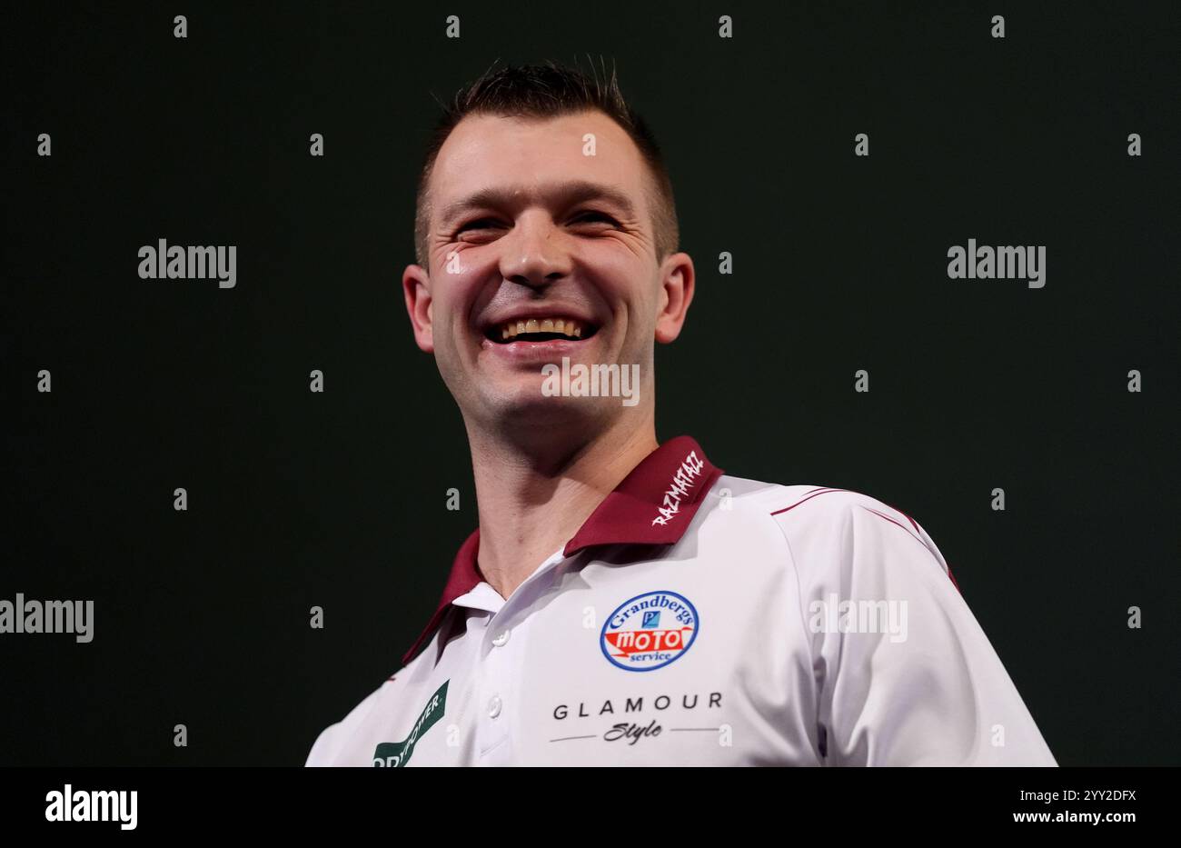 Madars Razma celebrates after winning his first round match against ...