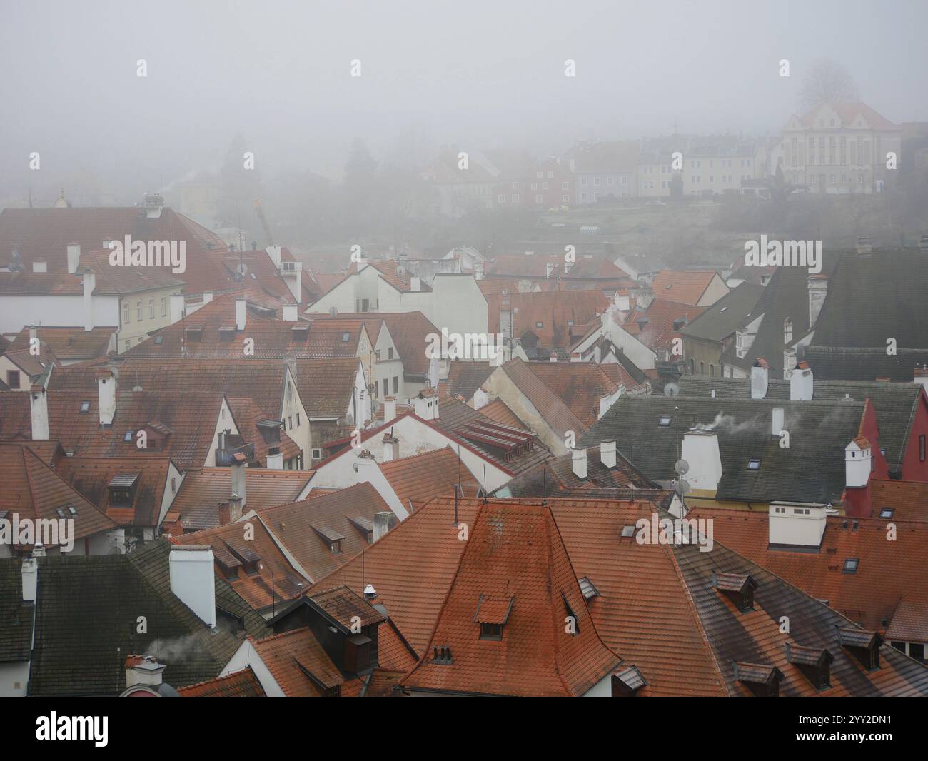 Cityscape of Cesky Krumlov historical center old town in a foggy gloomy ...