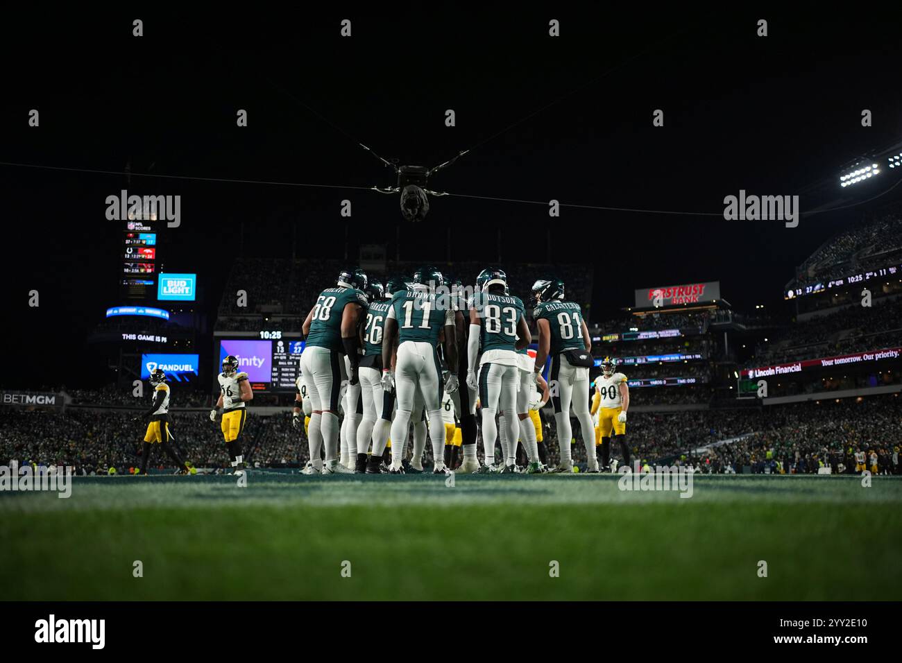 The Philadelphia Eagles huddle during an NFL football game between the ...
