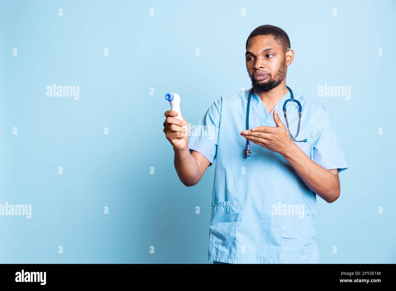 African american nurse advertising thermometer tool to measure fever ...