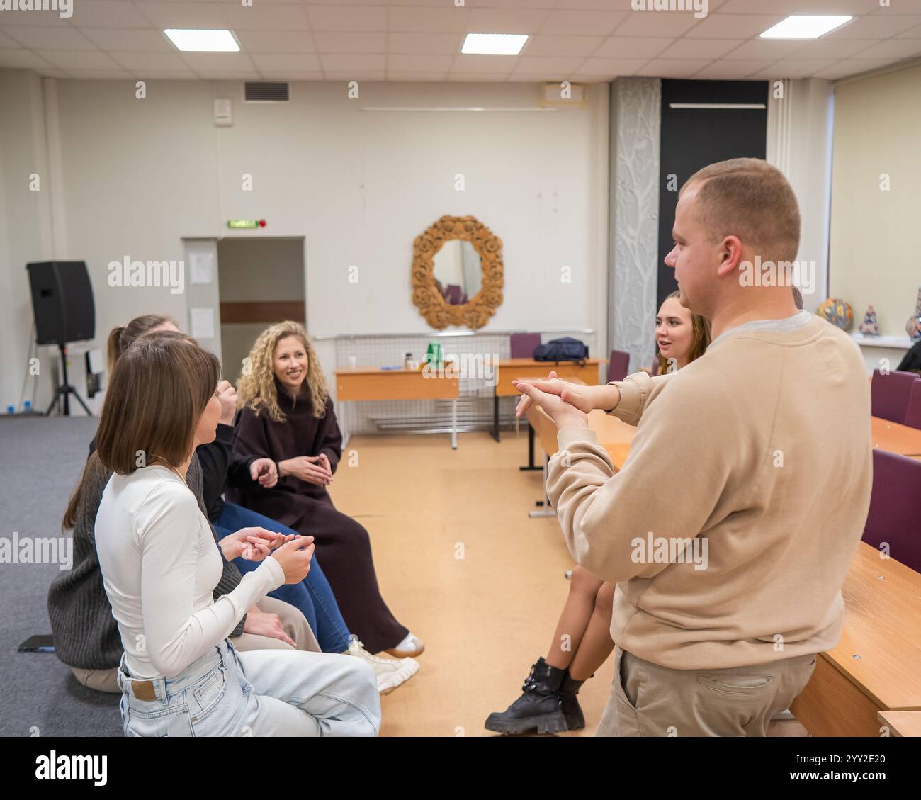 A group of young people talking in sign language Stock Photo - Alamy