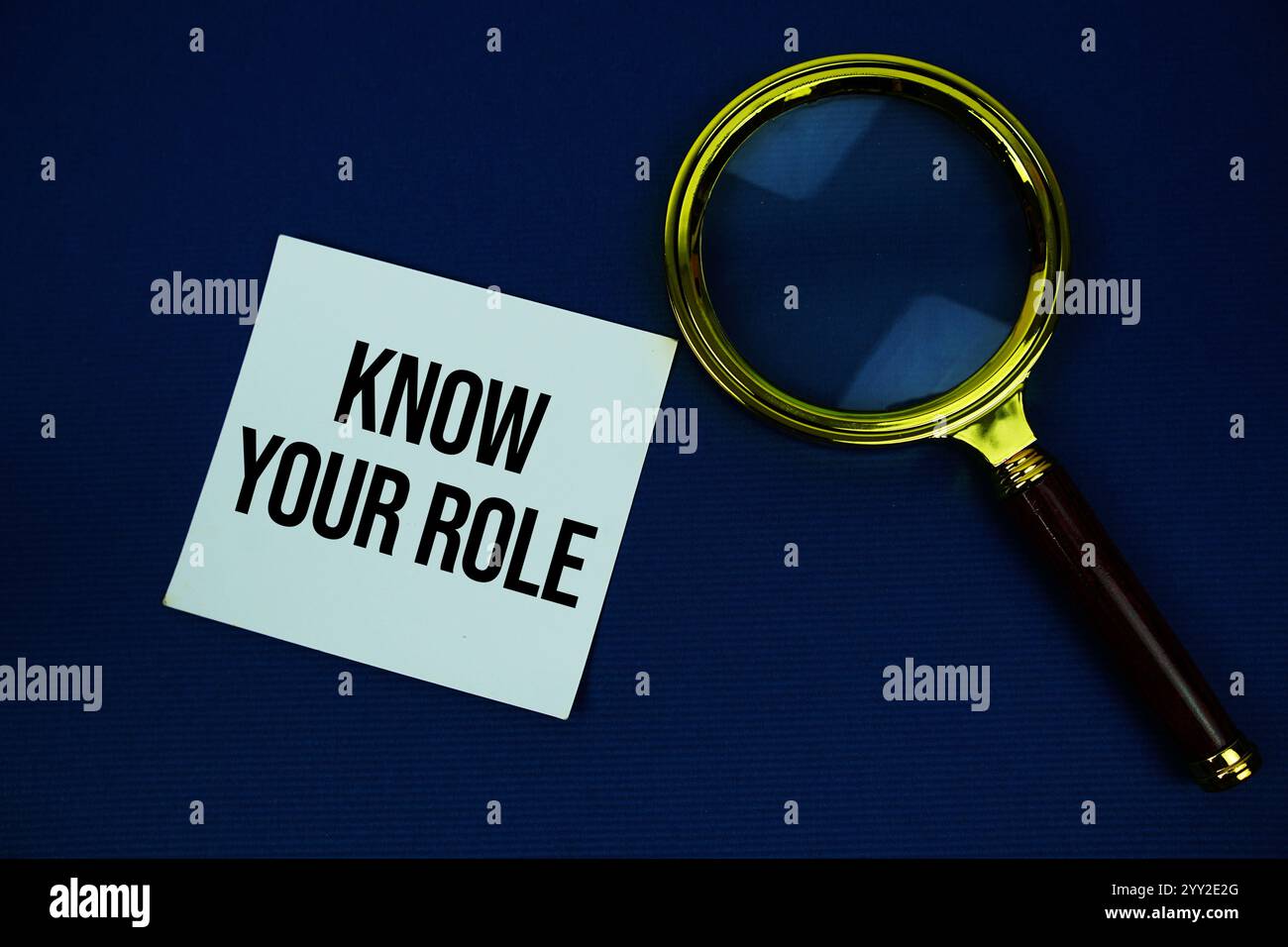 Know Your Role text on speech bluble with magnifying glass top view on ...