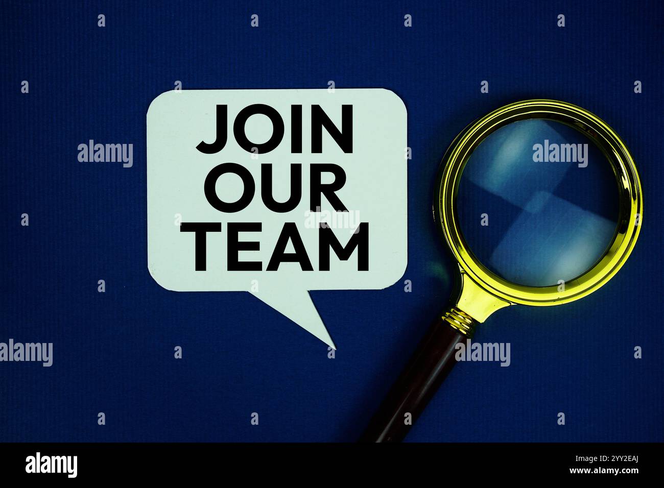 Join Our Team text on speech bubble with magnifying glass top view on ...