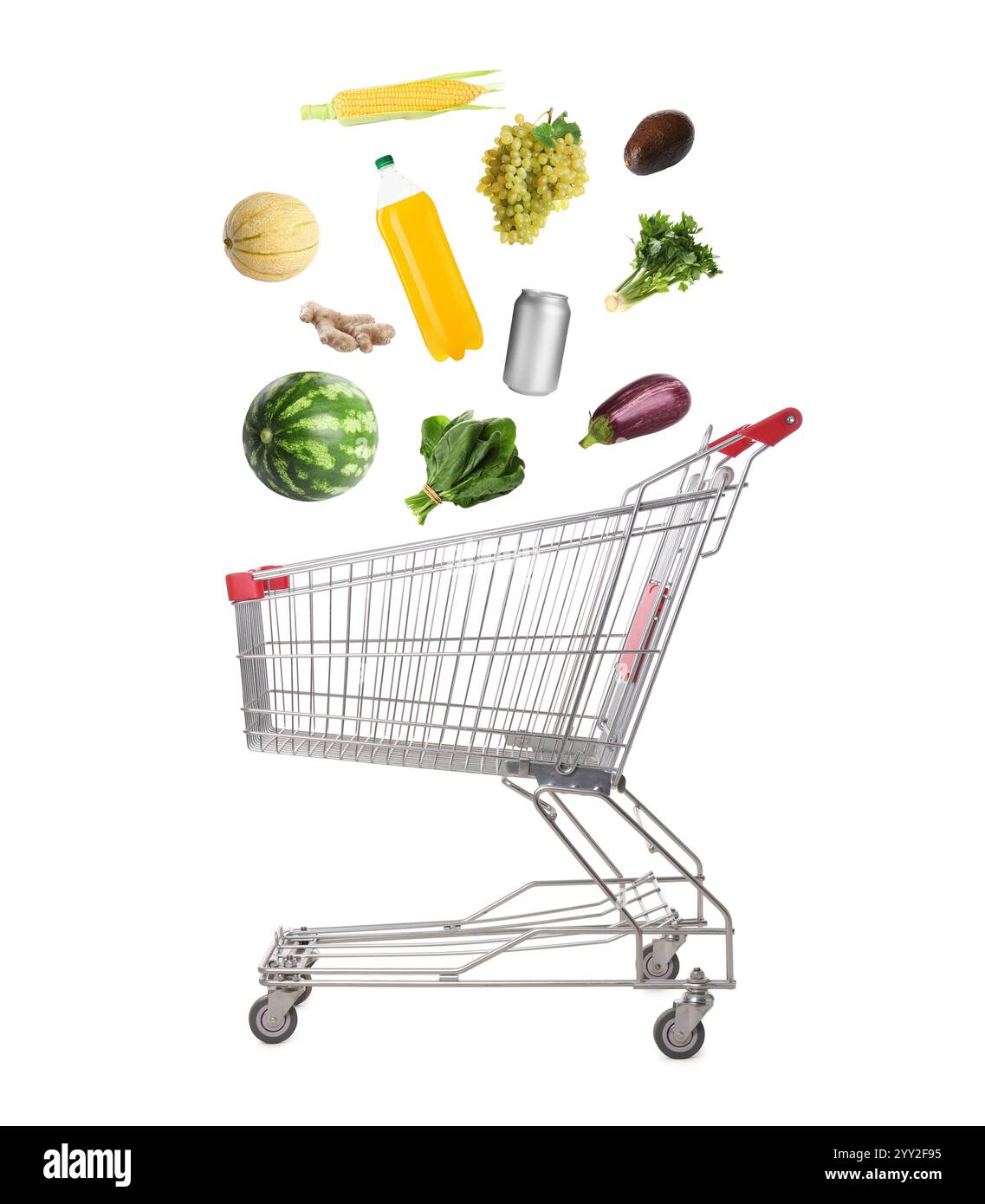 Groceries falling into shopping cart on white background Stock Photo ...