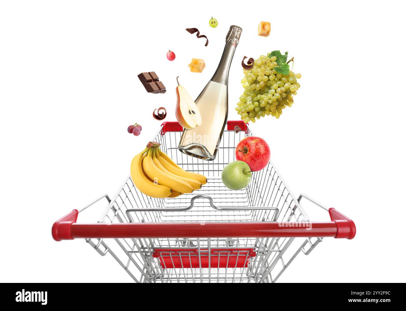 Groceries falling into shopping cart on white background Stock Photo ...