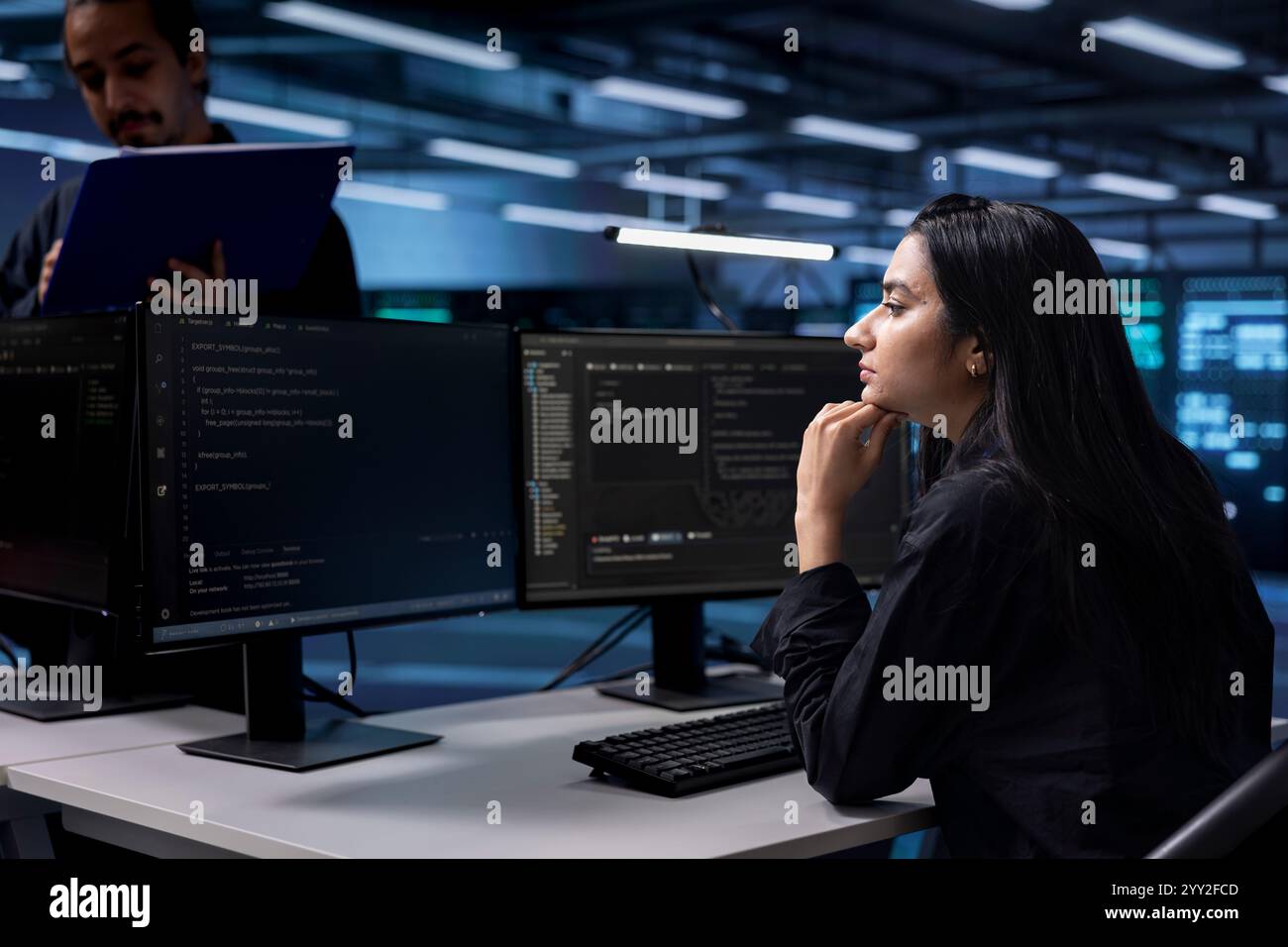 Software developer reconfiguring server farm to optimize it for data processing requirements of ...