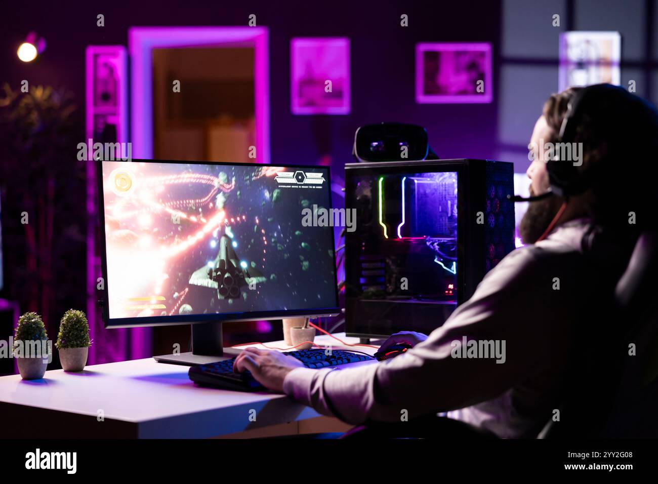 Streamer in studio streaming for online viewers, talking with them ...