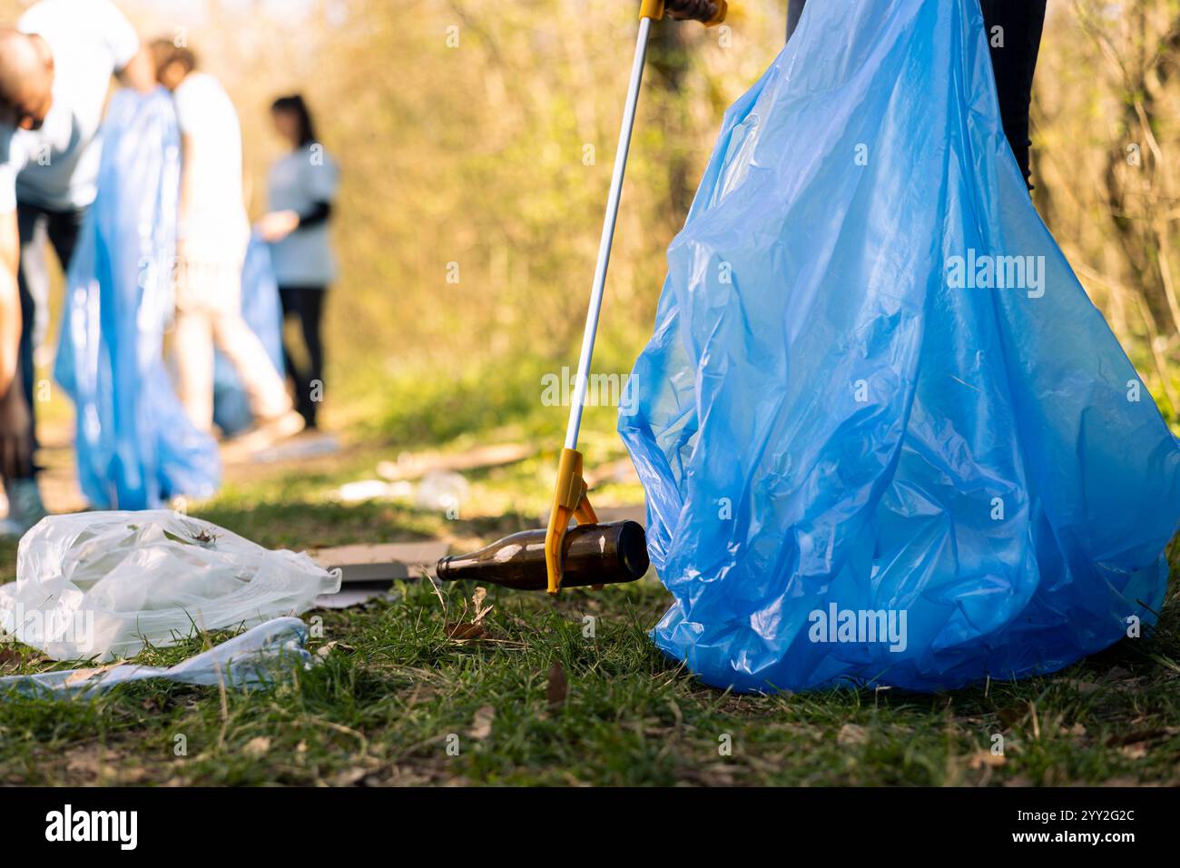 Volunteers group gathering to tidy up the woods of garbage, fighting ...