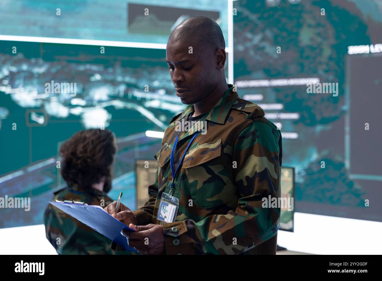 Army division officer overseeing special operation to gather real time information in control ...
