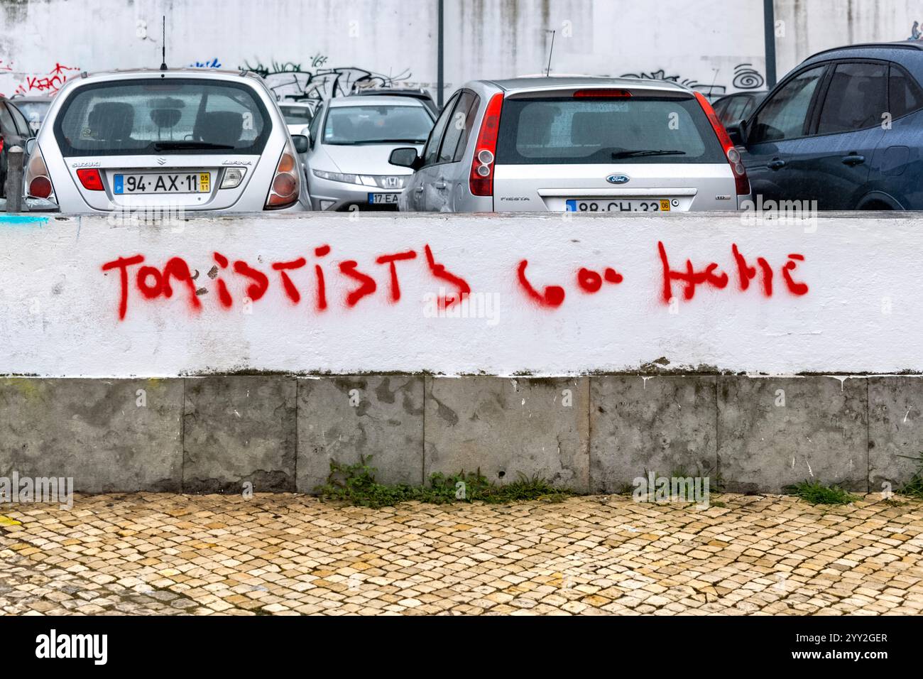 Red painted words tourists go home hi-res stock photography and images ...