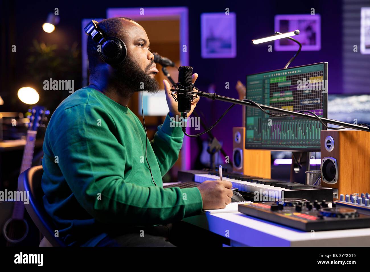 Musician artist thinking about new verses to fit the rhymes of the song ...