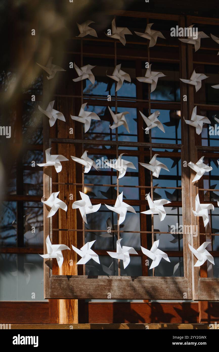 White paper pinwheels on wooden window in Japanese village. Concept of ...