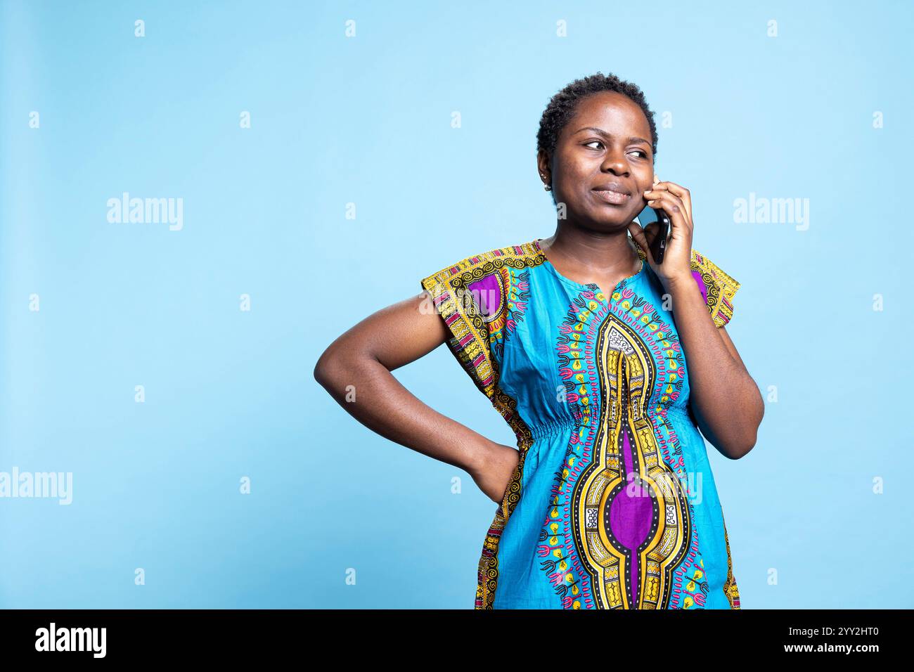African american woman chatting on phone call in studio, answering ...
