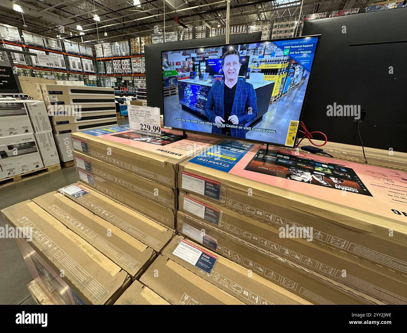 A 42-inch television sits on top of a display of the sets in shipping ...