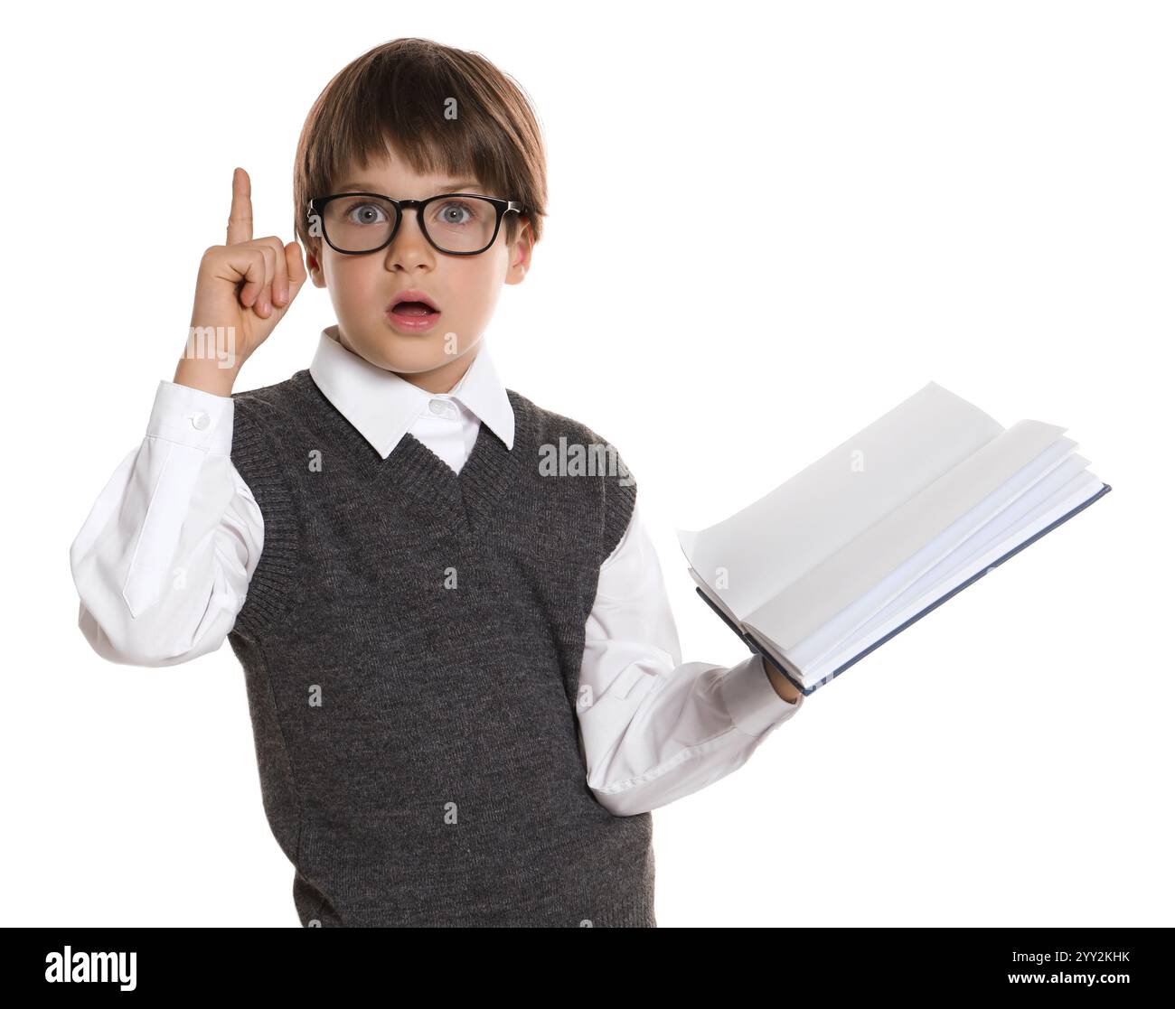 Learning alphabet. Little boy with book pointing at something on white ...