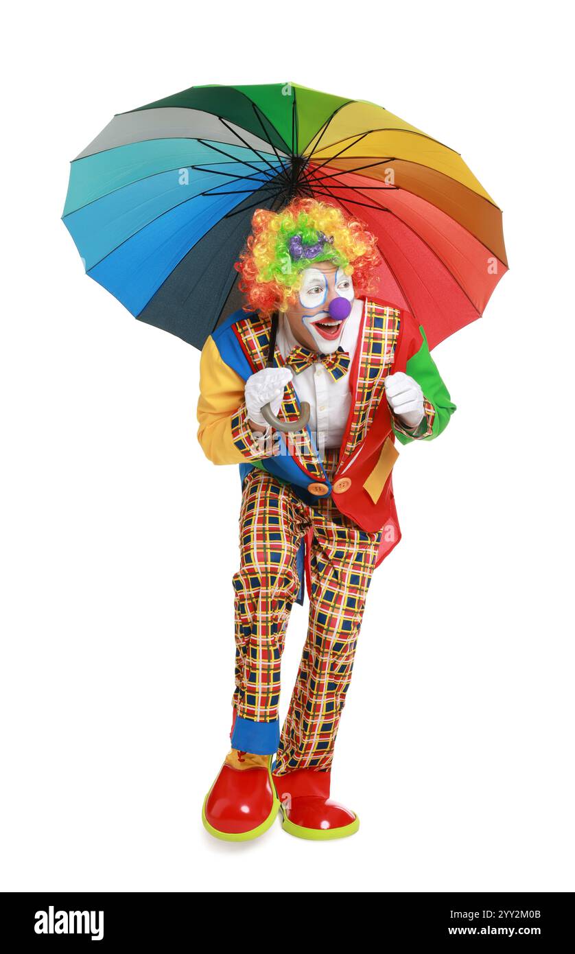 Happy clown with colorful umbrella on white background Stock Photo - Alamy