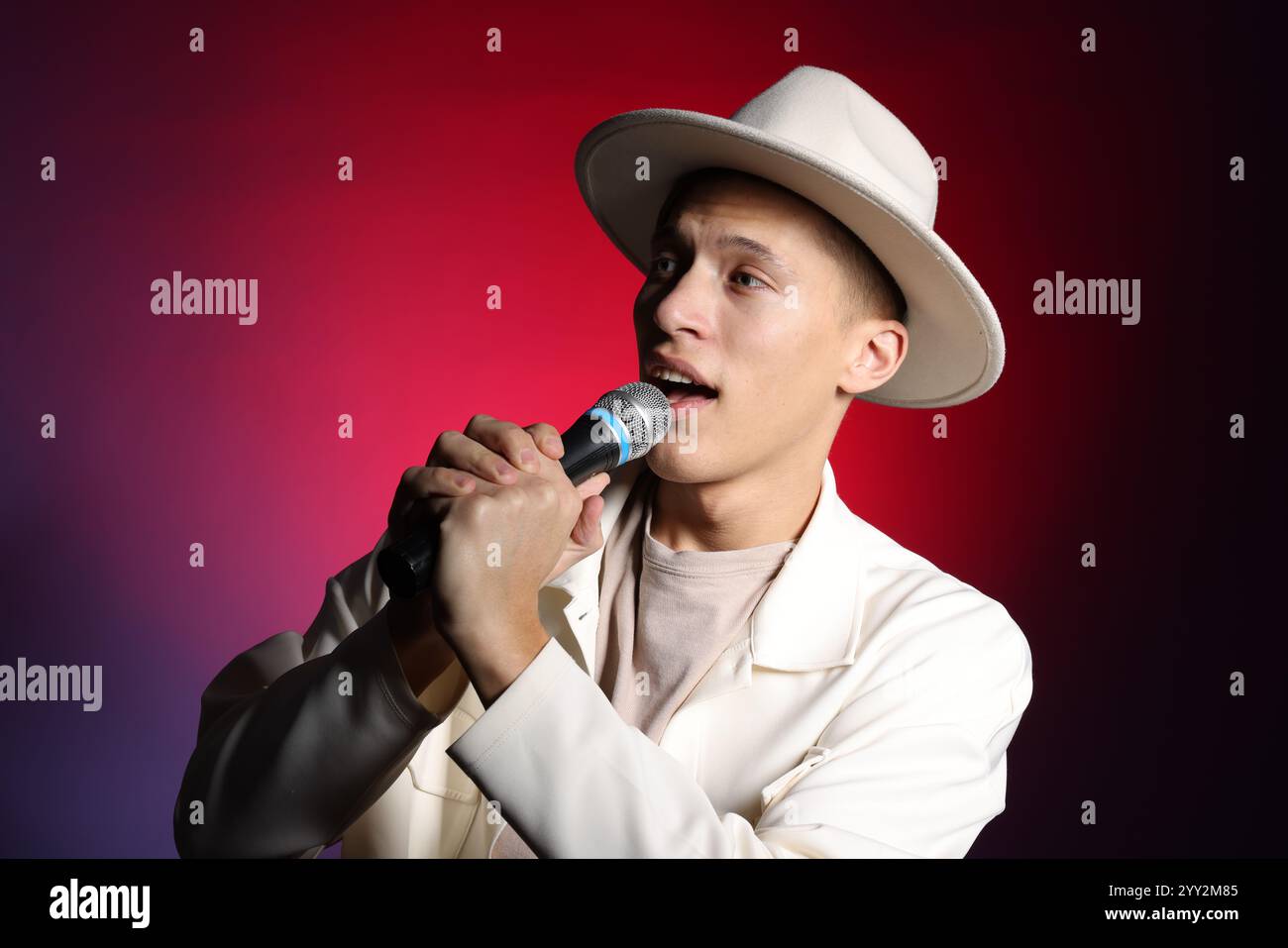 Young man singing talent show hi-res stock photography and images - Alamy