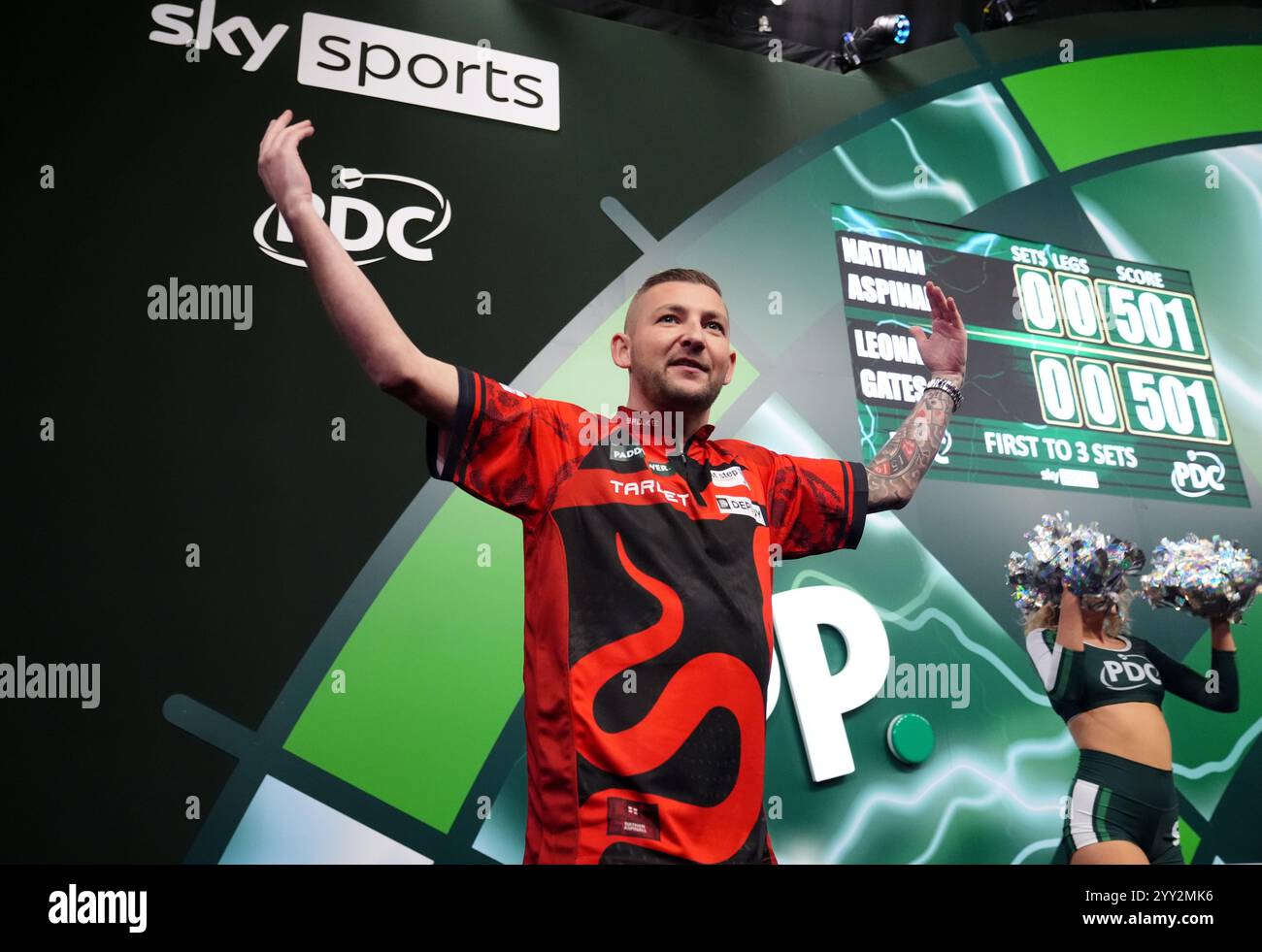 Nathan Aspinall walks out ahead of his second round match against ...