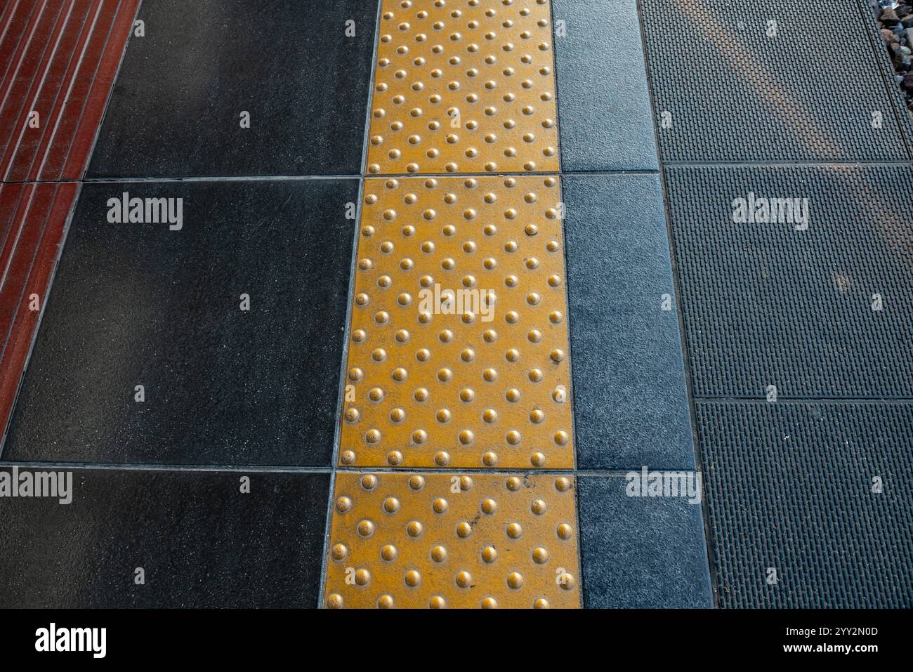 Crossroads with safe pedestrian crossings, floor tiles and path for the ...