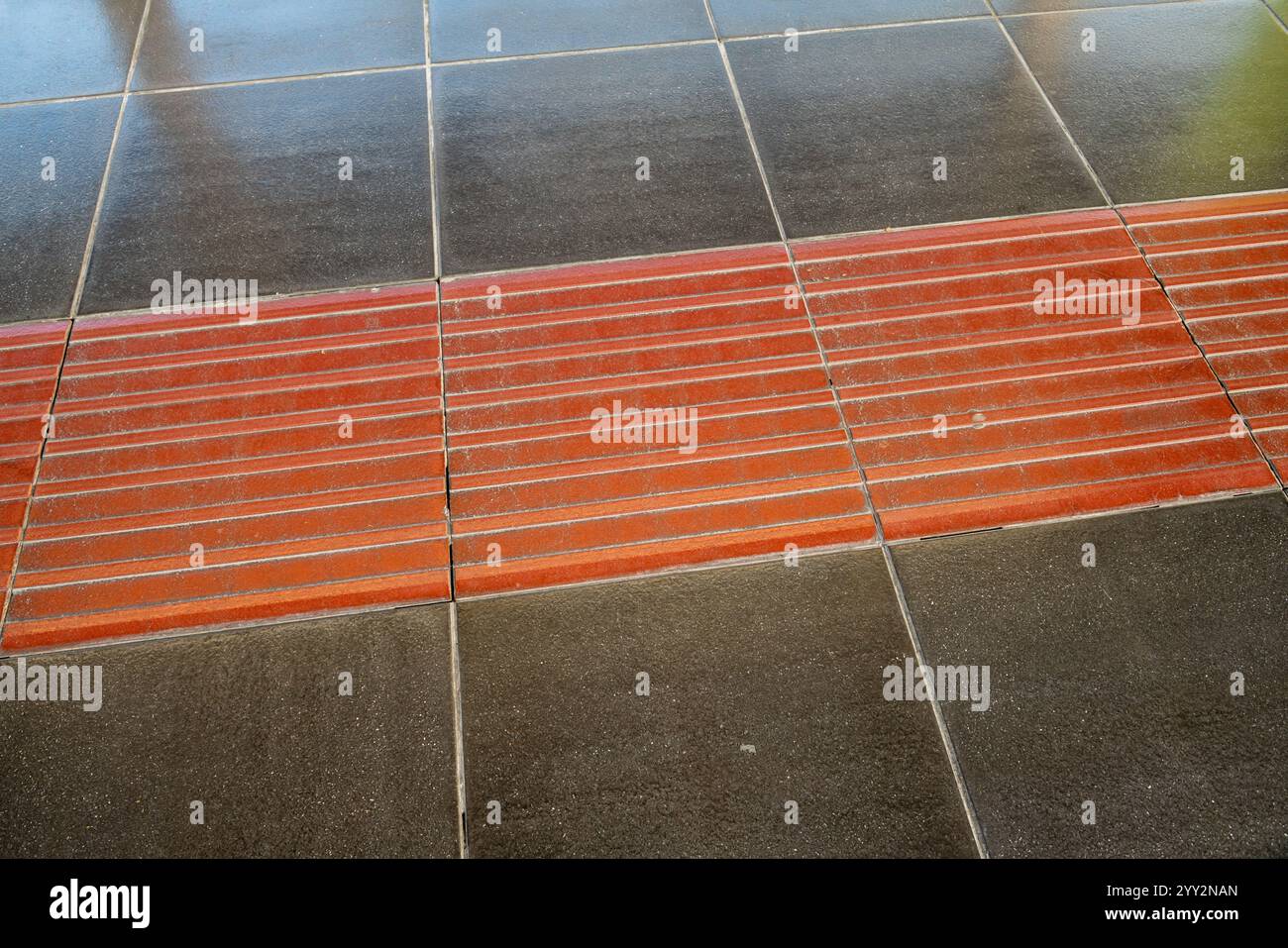 Crossroads with safe pedestrian crossings, floor tiles and path for the ...