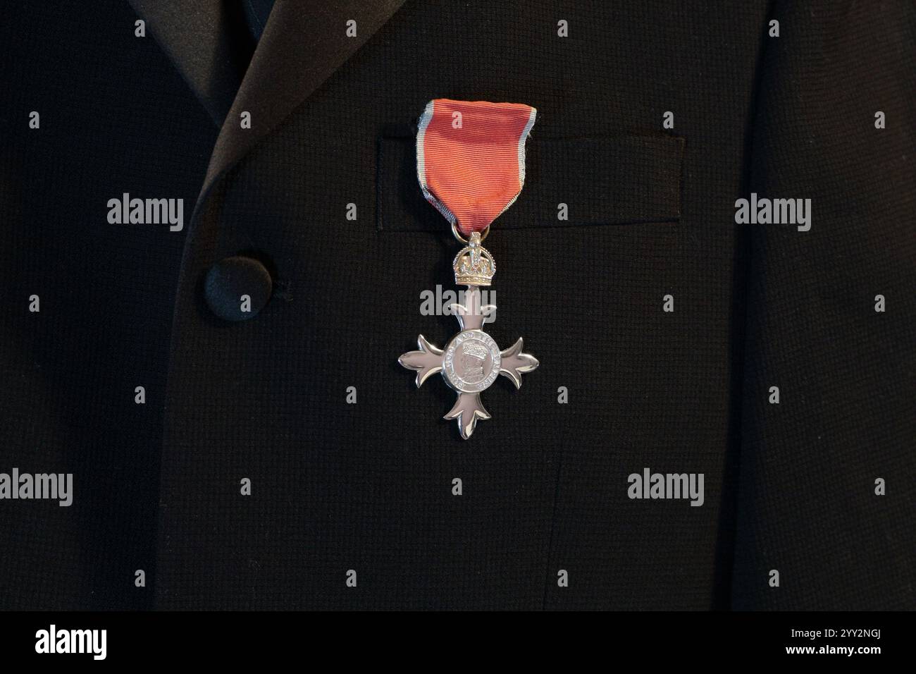 British MBE medal worn on black tuxedo jacket, Member of the British ...
