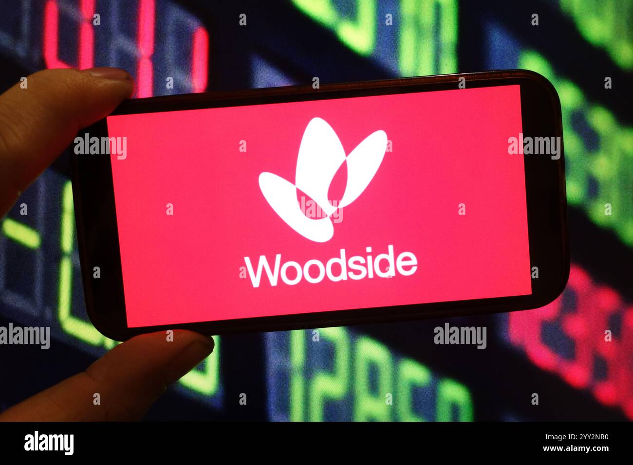 In this photo illustration, the Woodside Energy company logo is seen ...