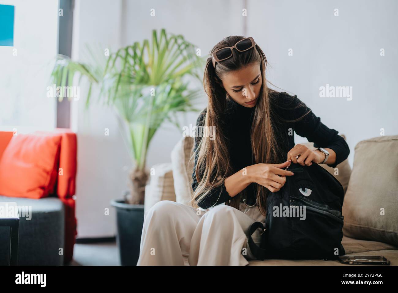 Student preparing backpack at home before going to school Stock Photo ...